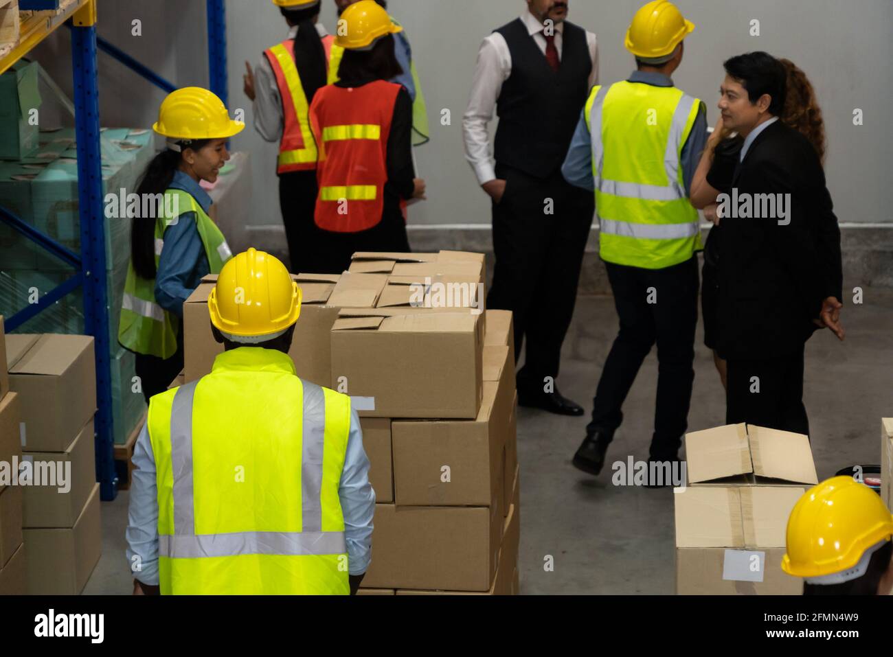 Many people , workers and manger work in warehouse or storehouse ...