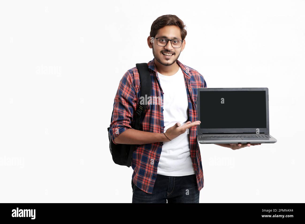 Indian college student showing laptop screen on white background Stock ...