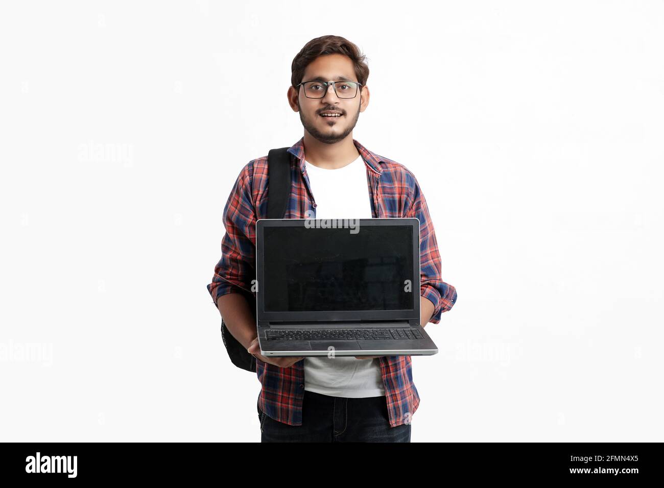 Indian college student showing laptop screen on white background Stock ...