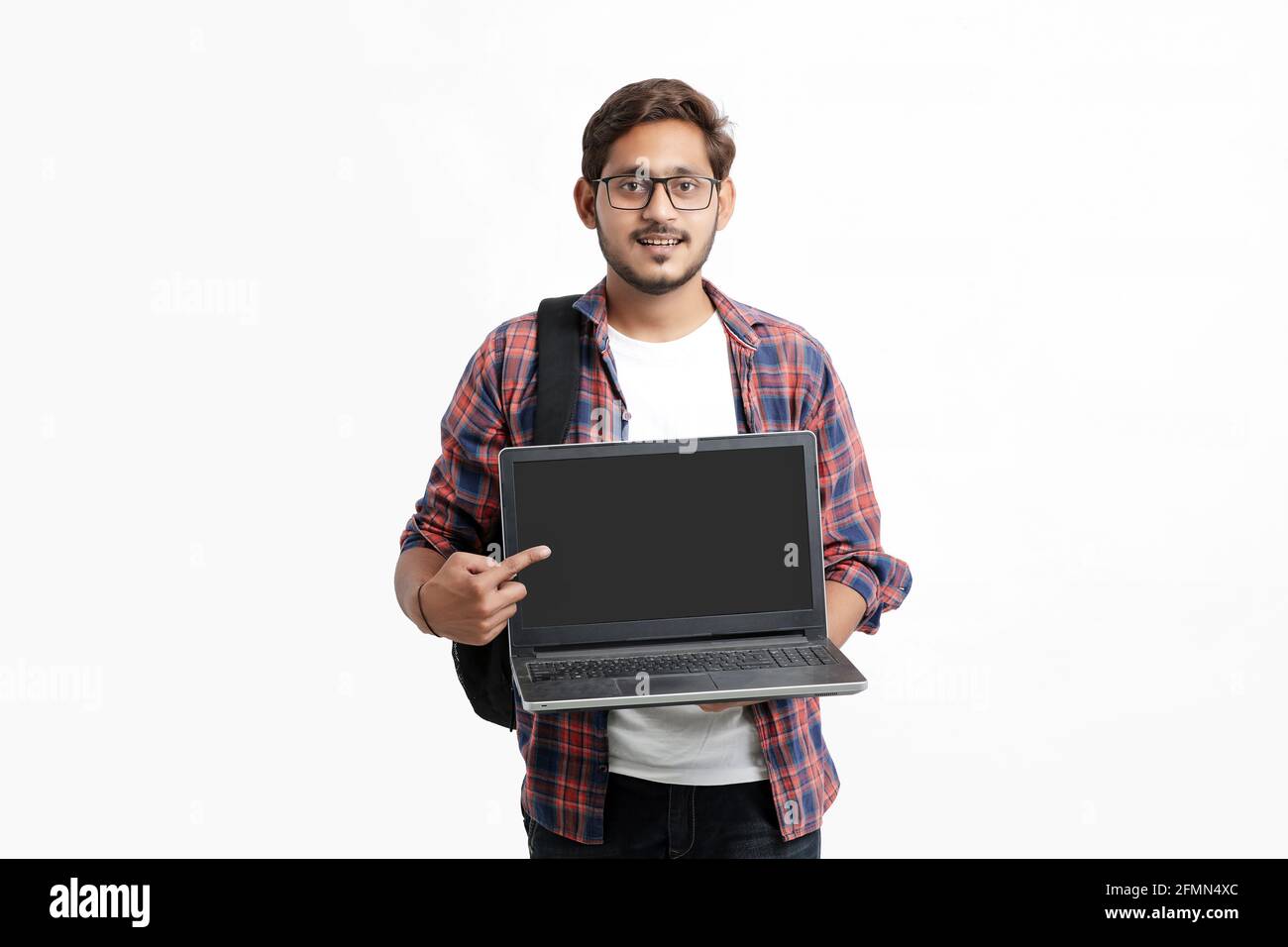 Indian college student showing laptop screen on white background Stock ...