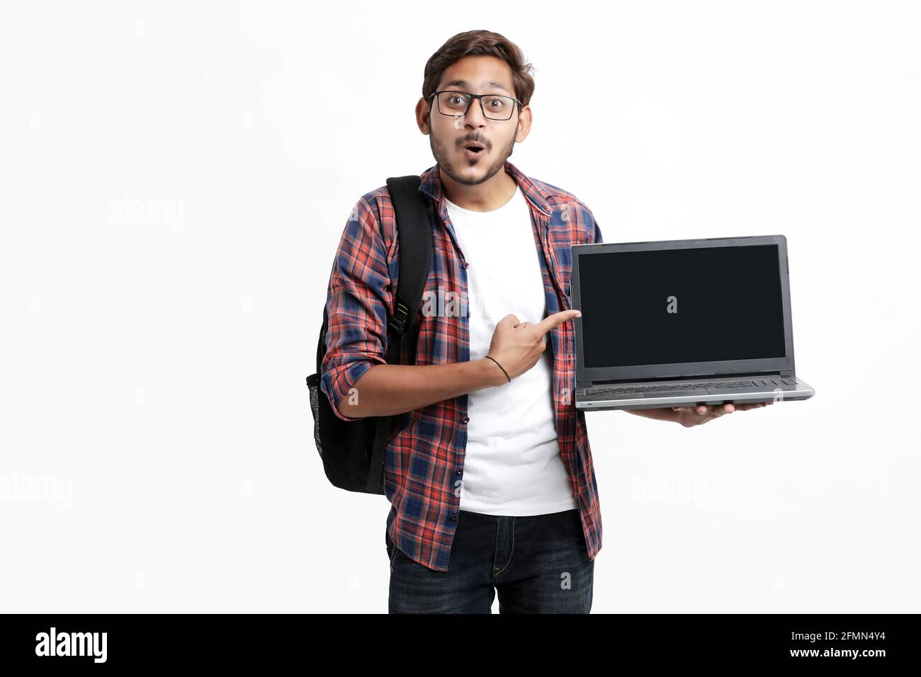 Indian college student showing laptop screen on white background Stock ...