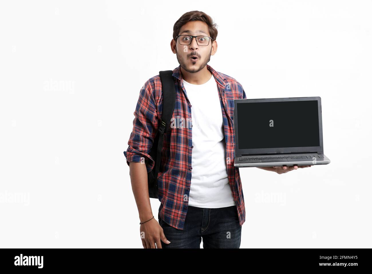 Indian college student showing laptop screen on white background Stock ...