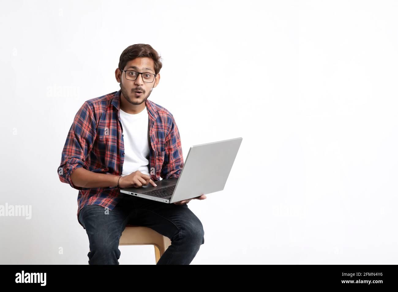 Indian man using laptop hi-res stock photography and images - Alamy