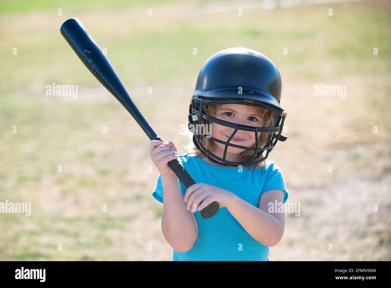 Baseball kid players in helmet and baseball bat in action Stock Photo ...