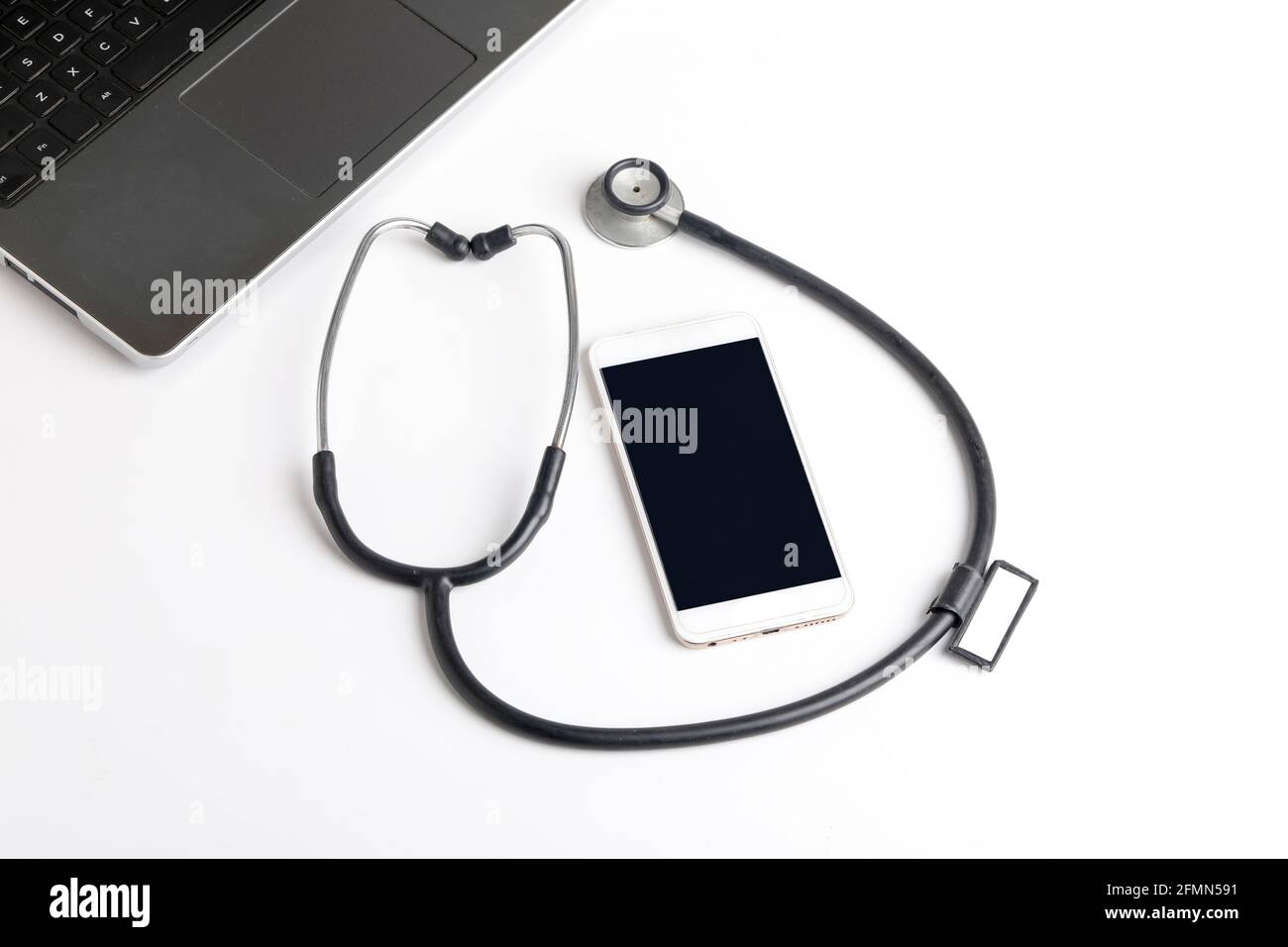Smartphone and stethoscope on white background. Online medicine ...