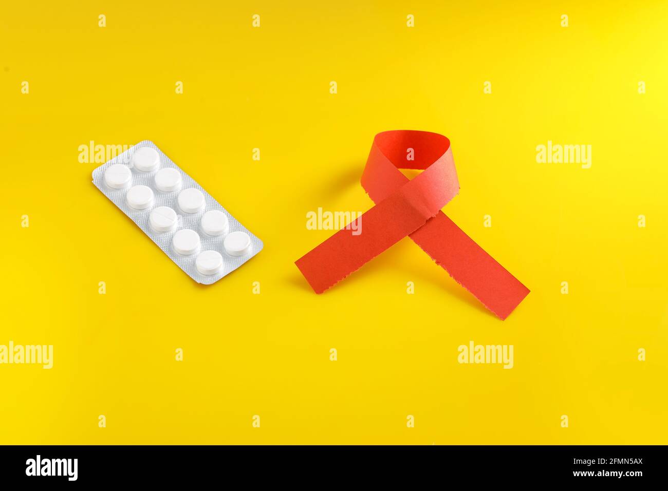 White medical tablet strip on yellow background Stock Photo - Alamy