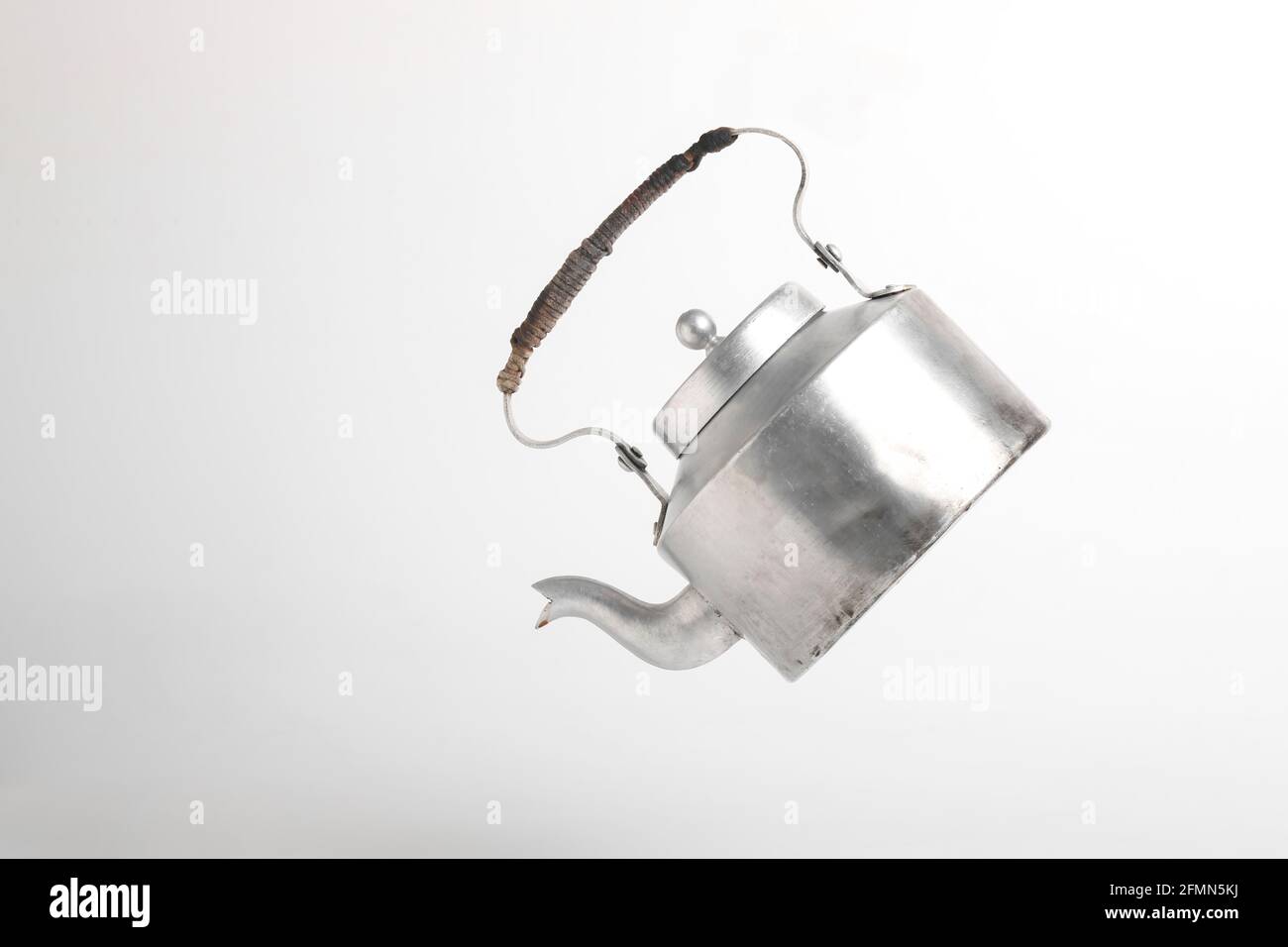 Aluminum tea kettle or tea pot on white background Stock Photo - Alamy