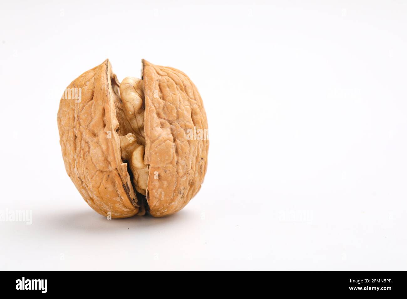 Walnuts and cracked walnut, isolated on white background Stock Photo ...