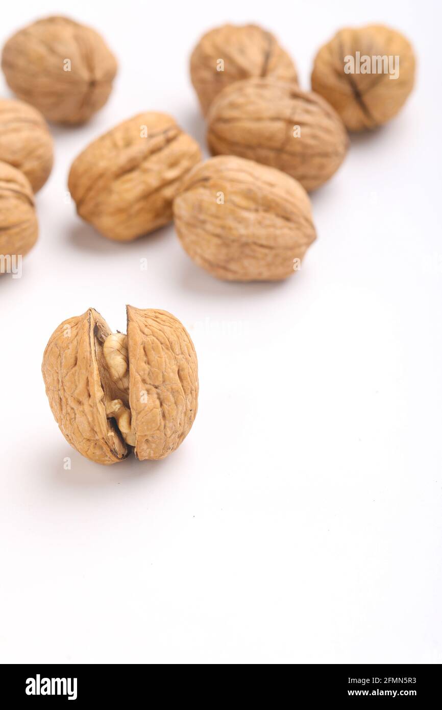 Walnuts and cracked walnut, isolated on white background Stock Photo ...