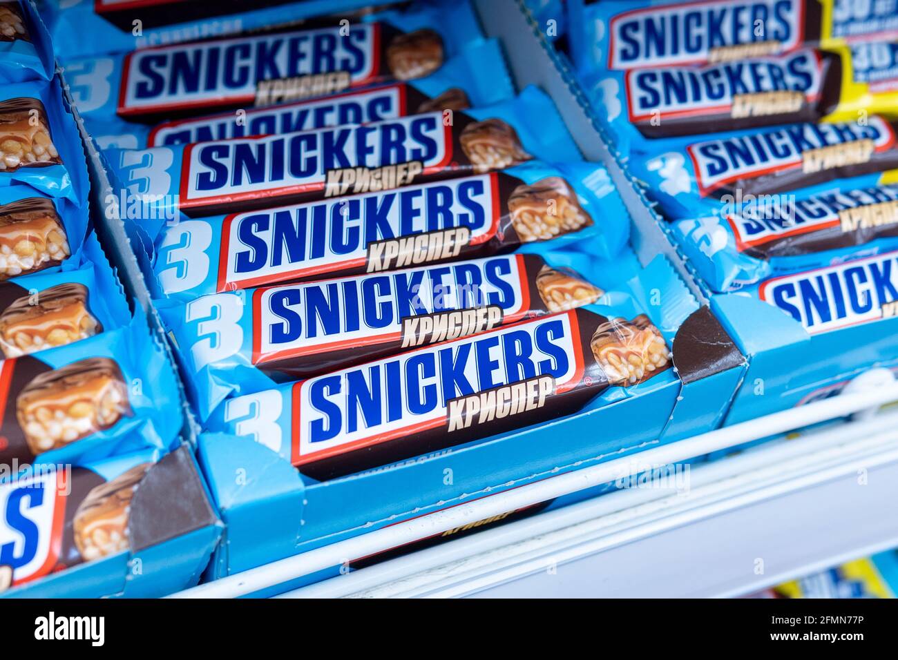 Tyumen, Russia-February 26, 2021: Snickers is a chocolate bar with ...