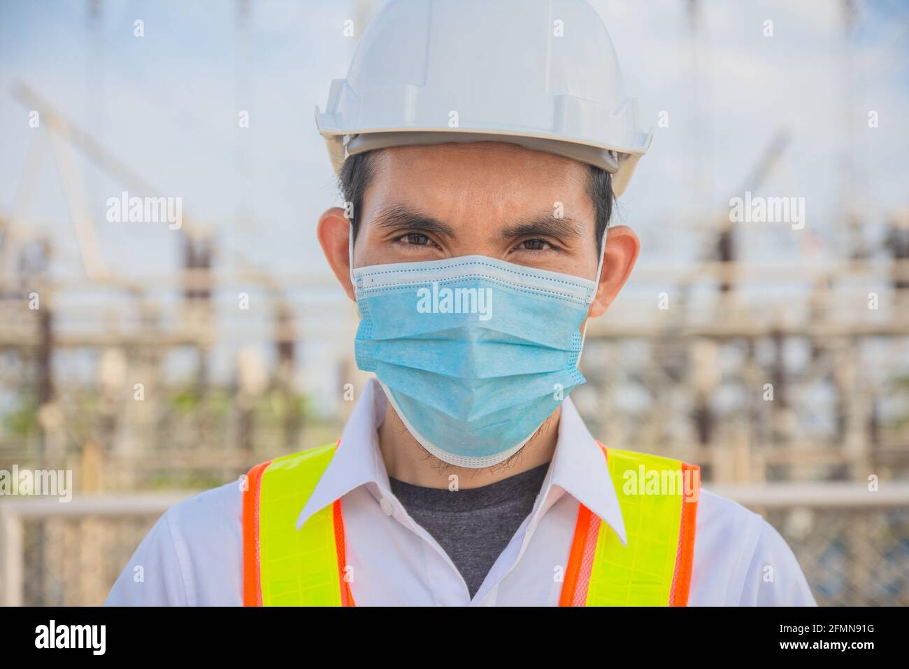 Asian man wear mask protect coronavirus and work in power plant Stock ...