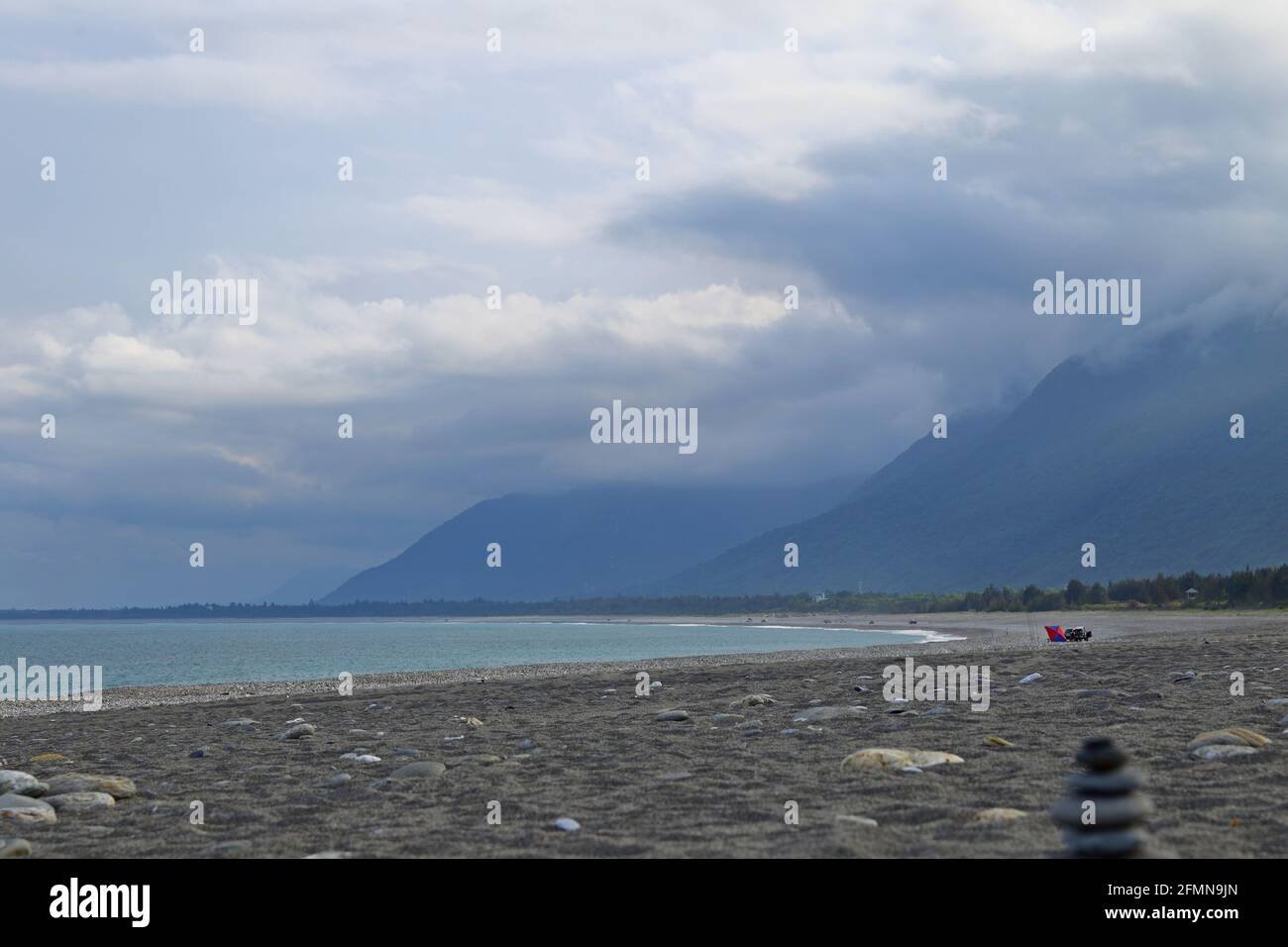 Beautiful scenic of ocean with stone covered beach at Manbo beach ...