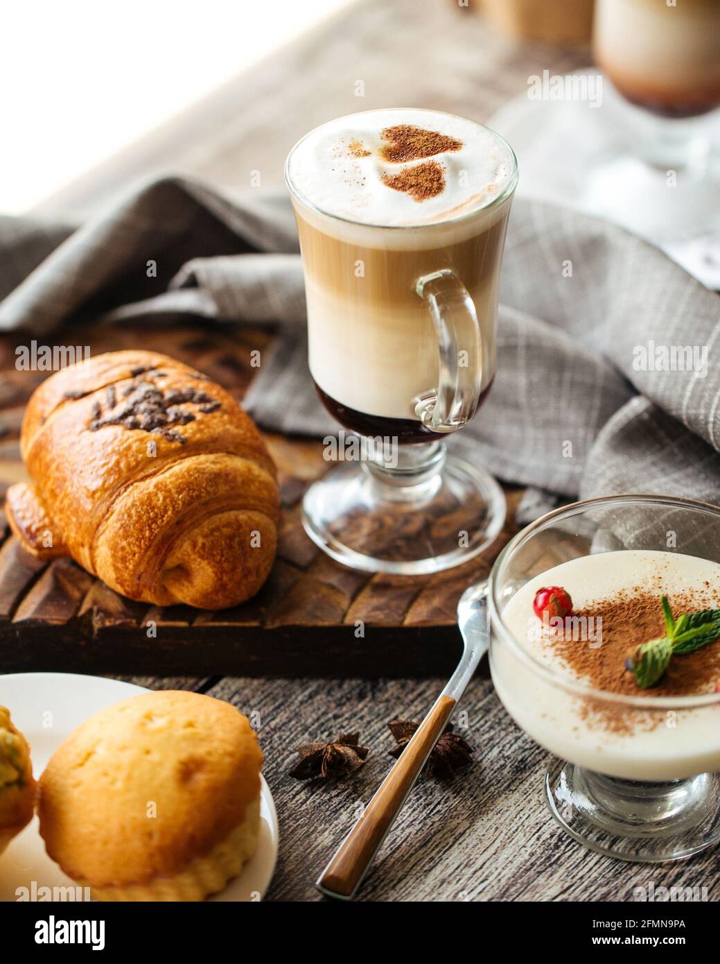 Coffee cafe table with desserts and latte drinks Stock Photo - Alamy