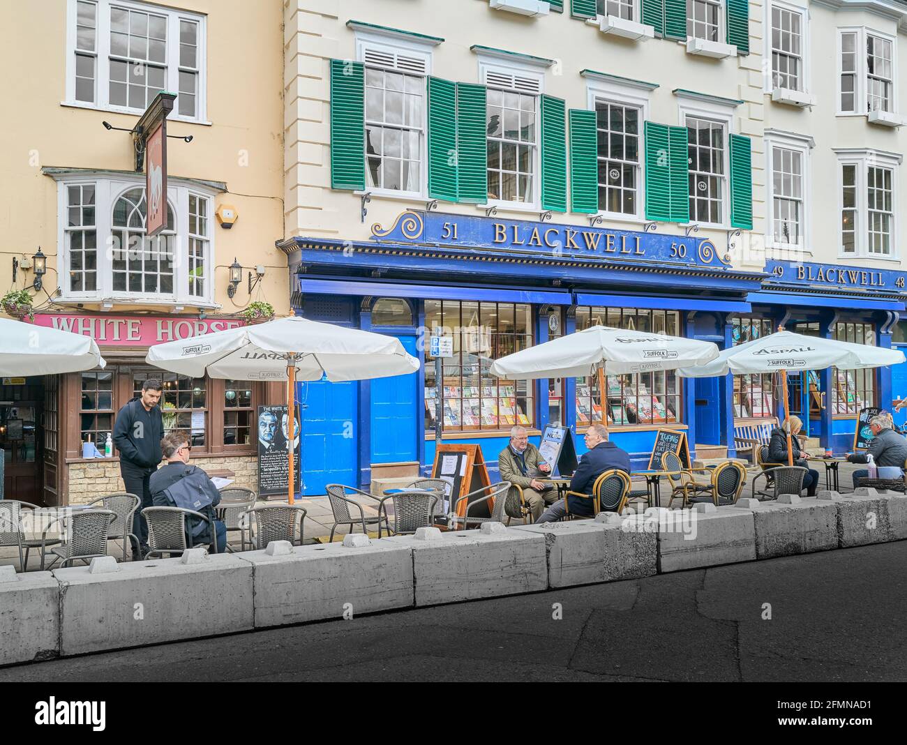 Customers sit at the outdoors cafe outside Blackwell's bookshop and the ...