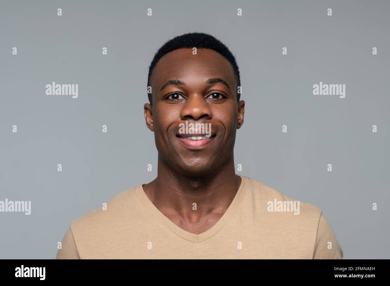 Dark skinned handsome young man hi-res stock photography and images - Alamy