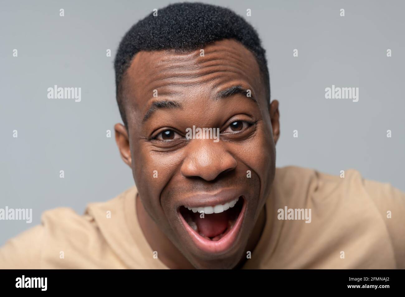 African man open eyes look hi-res stock photography and images - Alamy