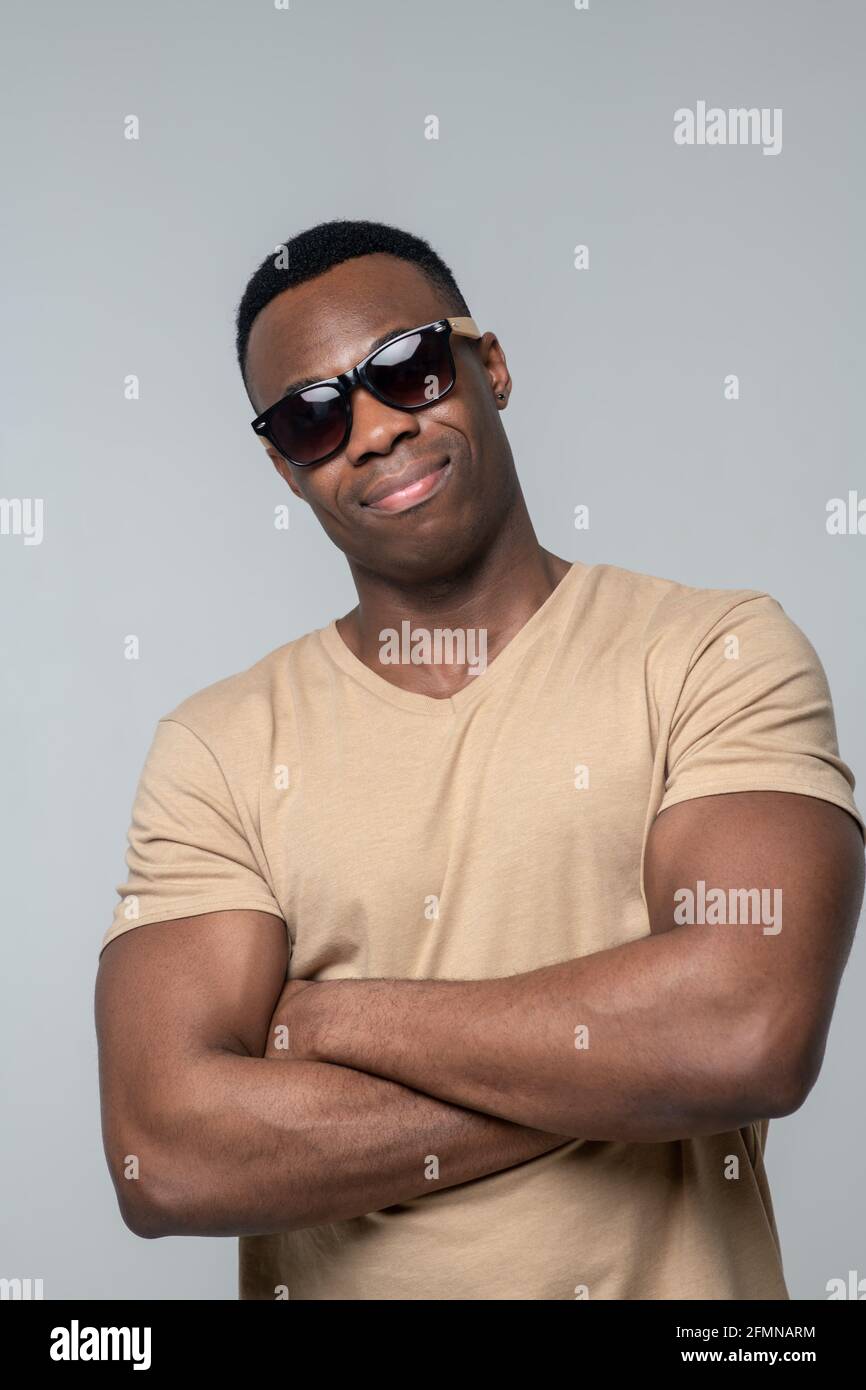 Man in sunglasses folded arms across chest Stock Photo - Alamy Man in sunglasses folded arms across chest Stock Photo - Alamy