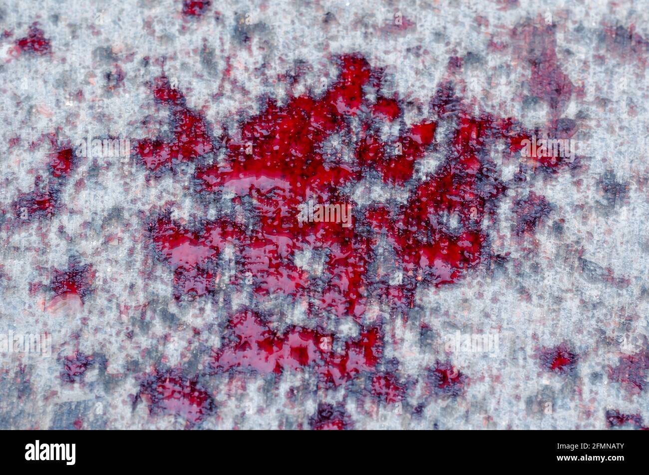 Blur, noise, selective focus. Defocused shot of blood on the asphalt ...