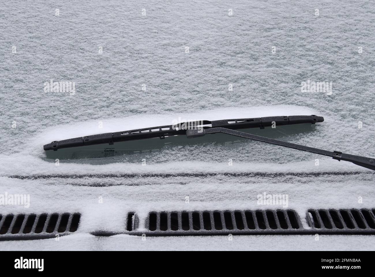 Windshield wiper on a car covered with snow Stock Photo - Alamy