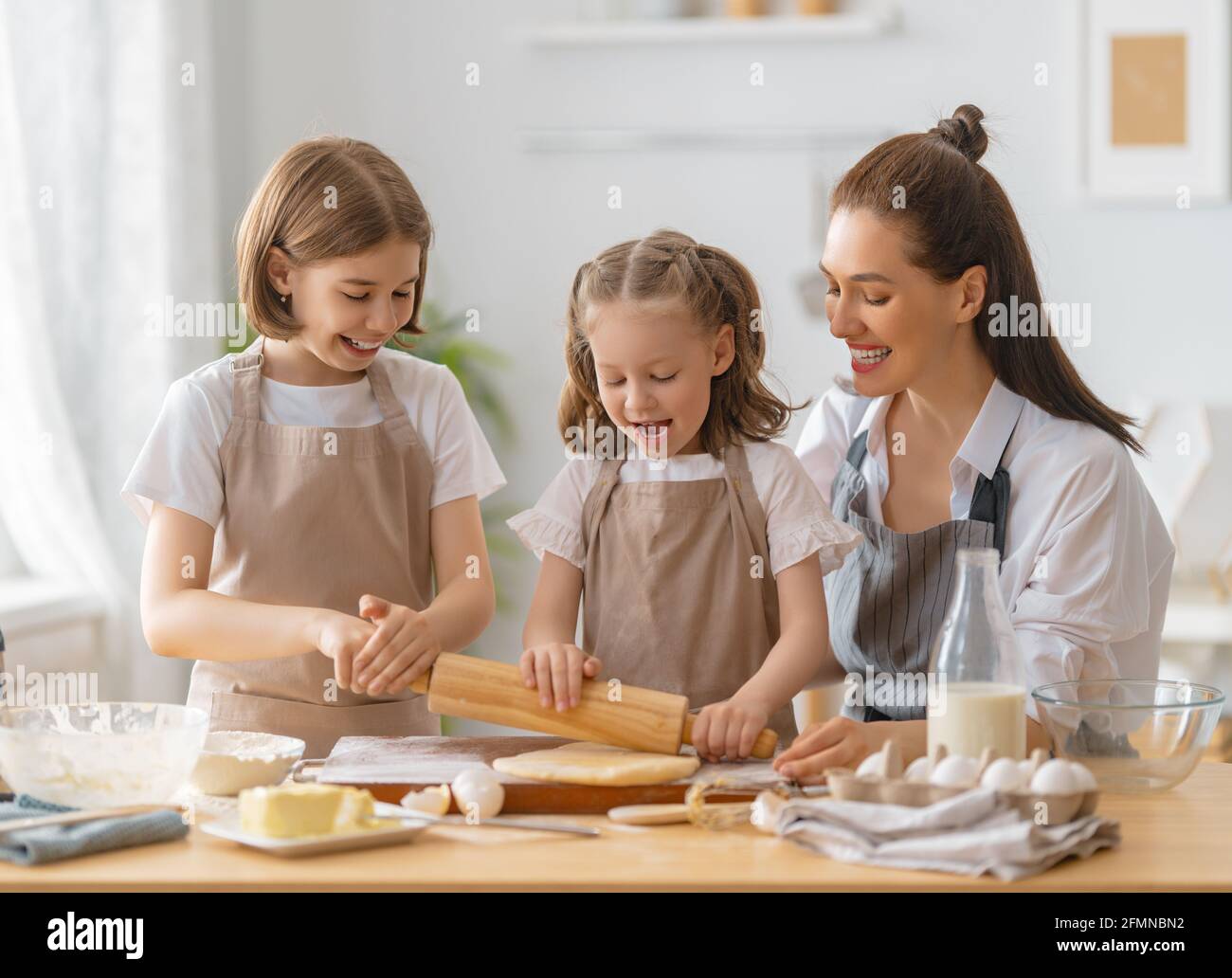 Two girls baking cake in hi-res stock photography and images - Alamy