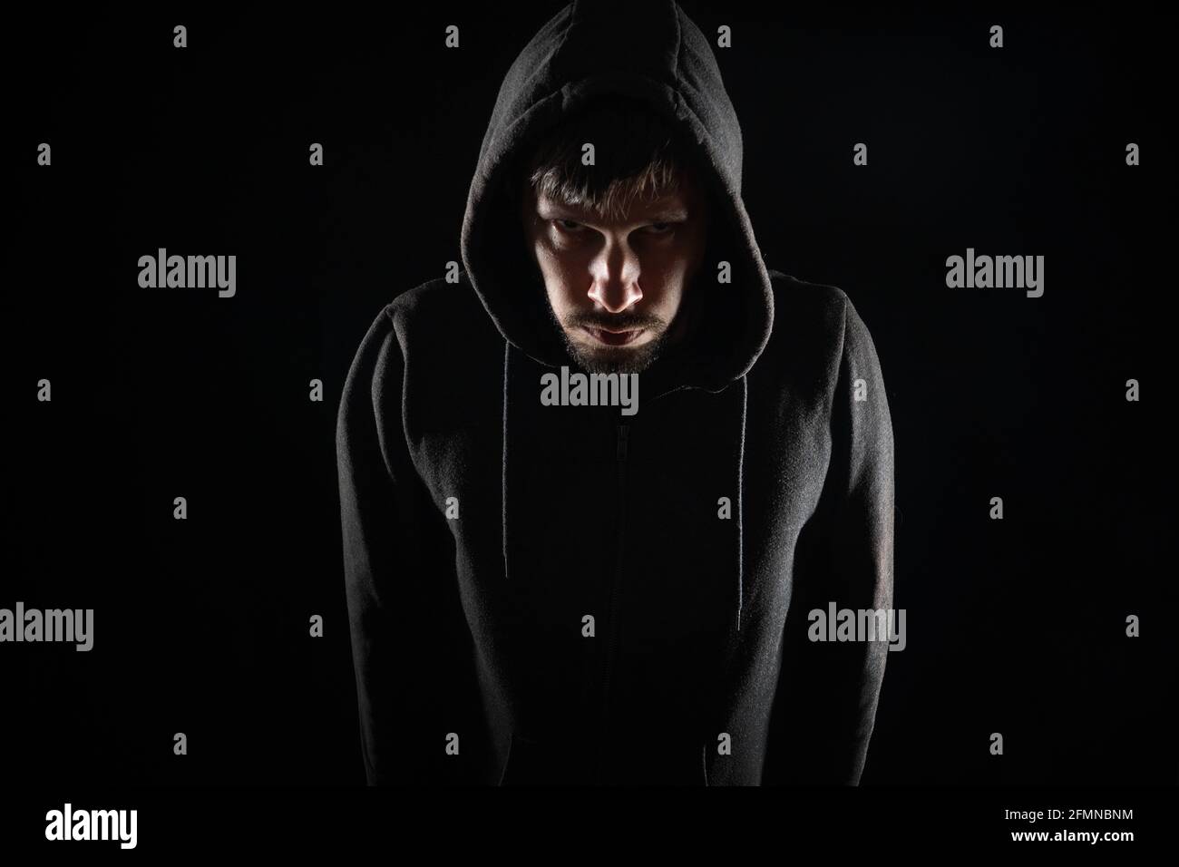 Scary stalker or hacker at night on black background Stock Photo - Alamy