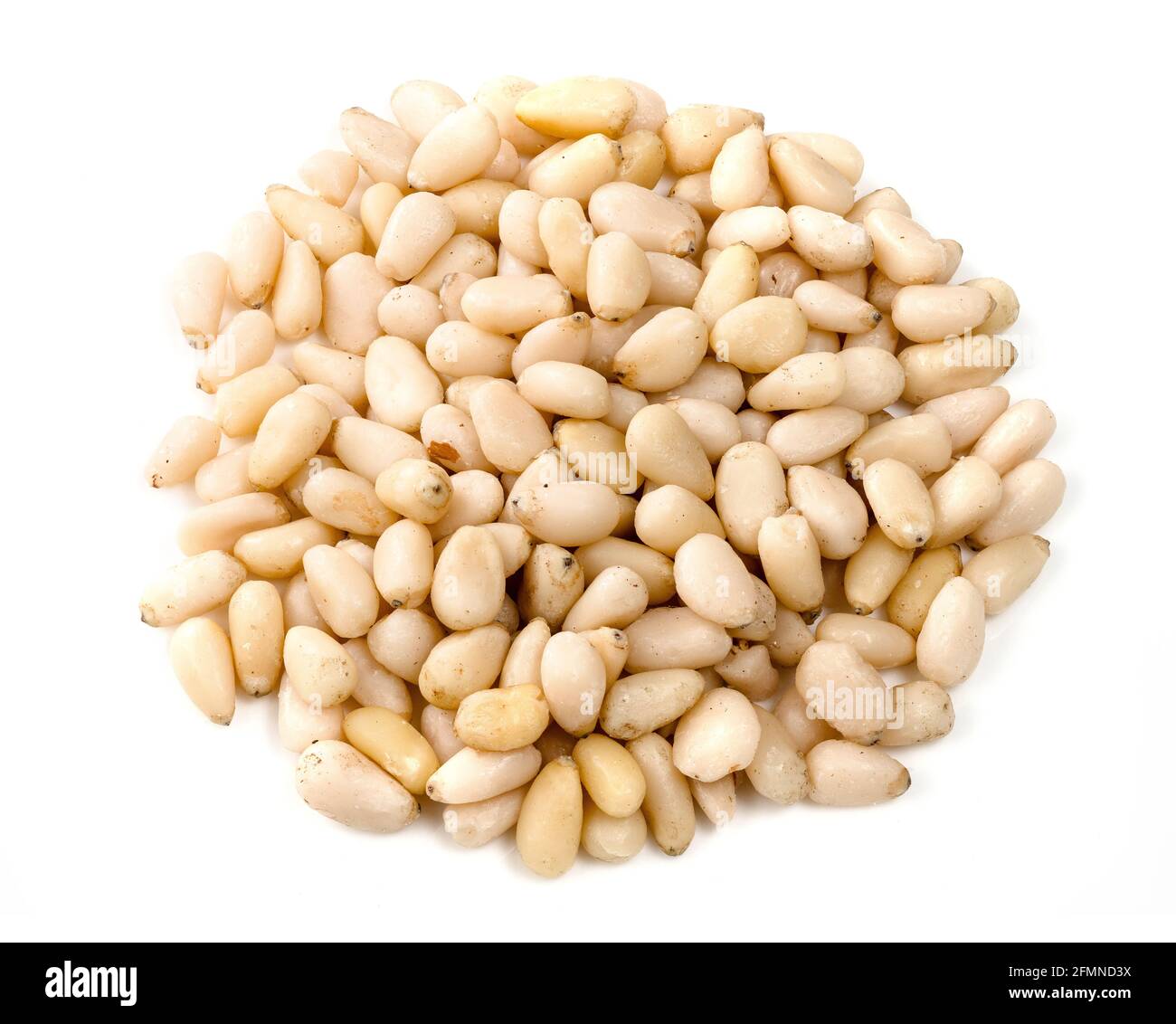 handful of unpeeled pine nuts closeup on white background Stock Photo ...