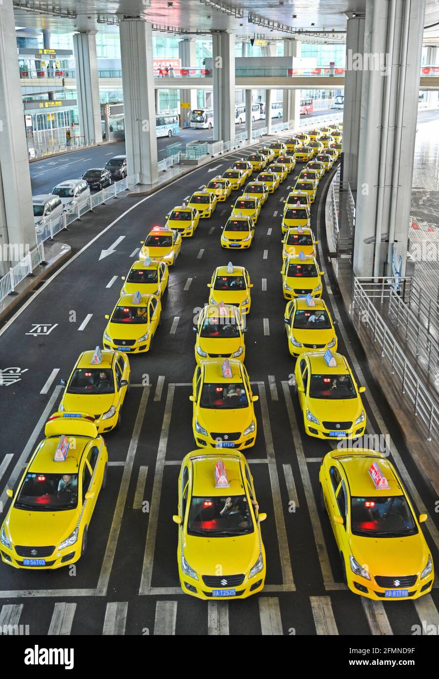 CHONGQING, CHINA - MAY 10, 2021 - A series of taxis line up outside the ...