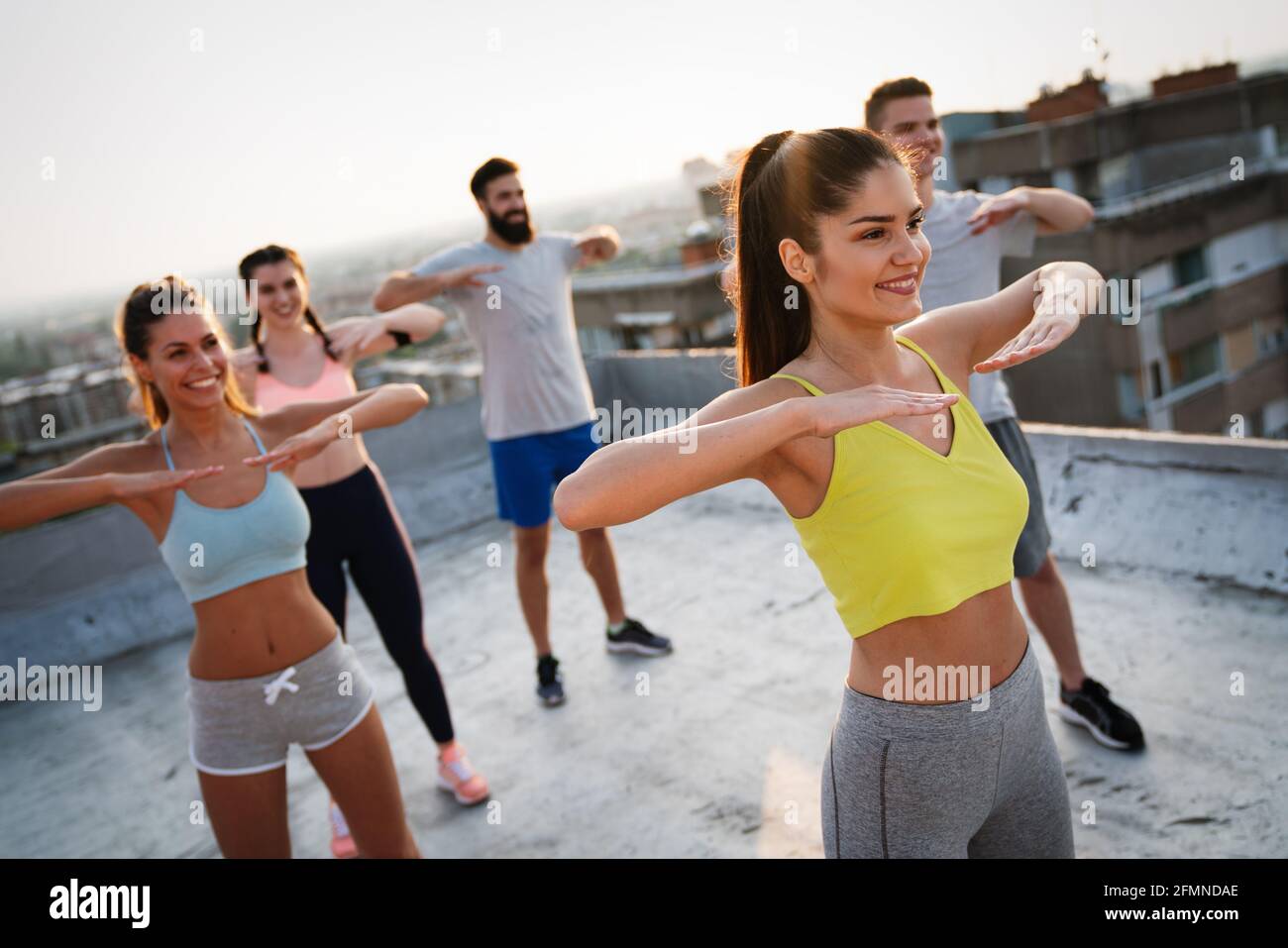 Fitness, sport, training and lifestyle concept. Group of fit people ...