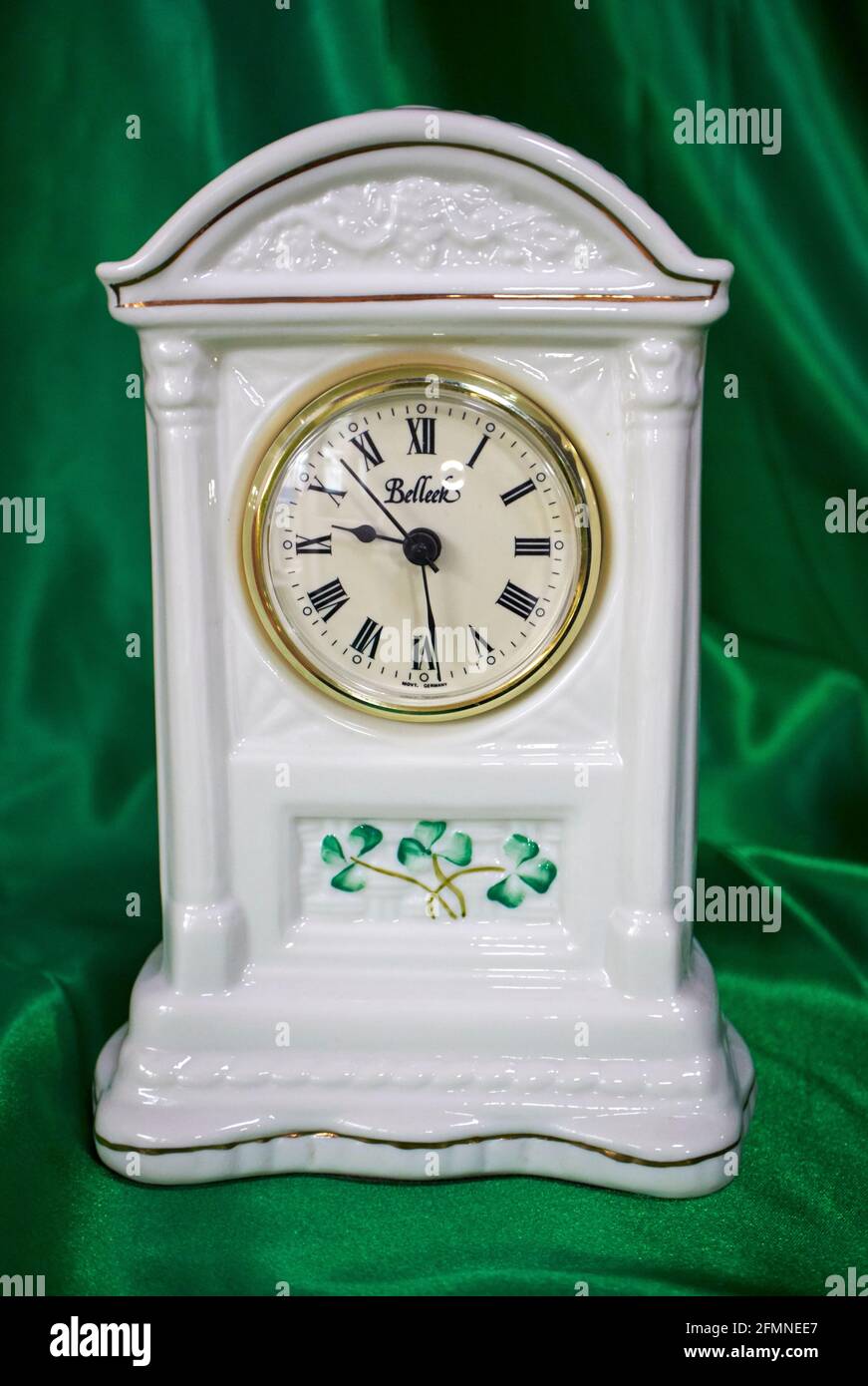 glenveagh clock from belleek pottery on a green background Stock Photo ...