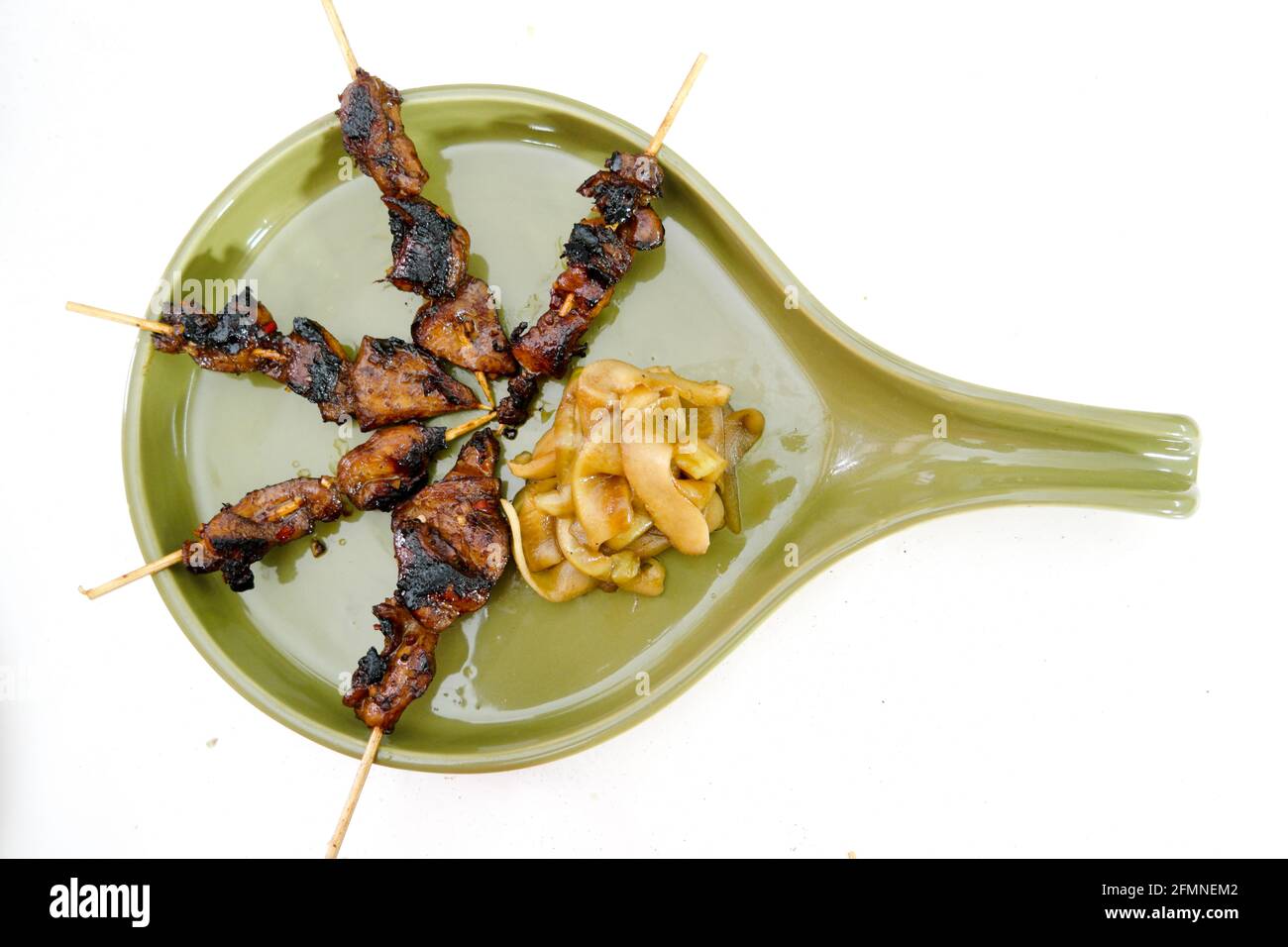 Top view of Chicken satay cooked with grilled meat and served with a ...