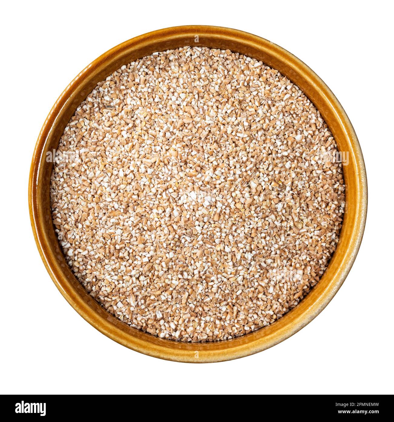 top view of raw Poltavskaya wheat groats (crushed partly hulled wheat ...