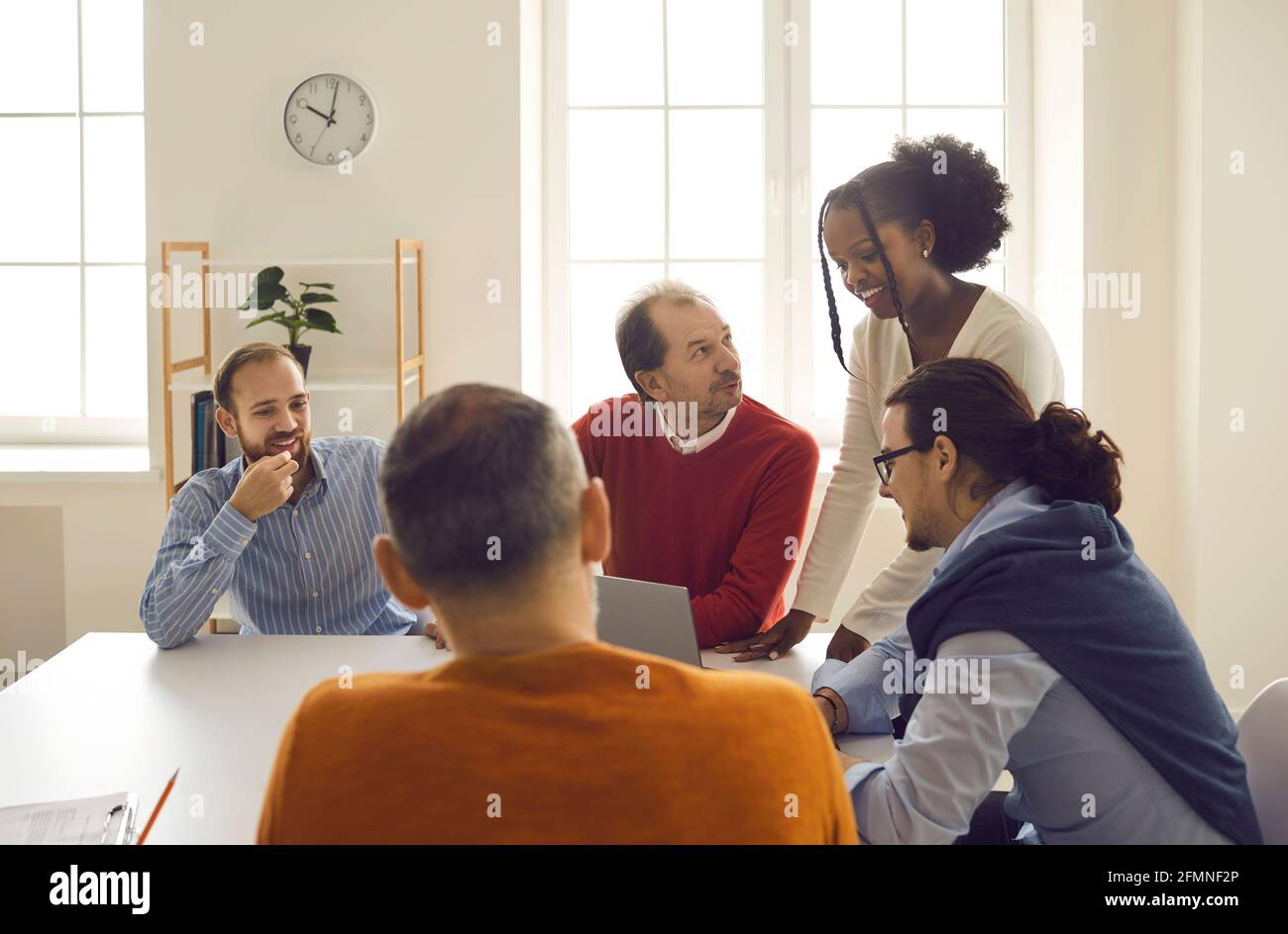 Diverse colleagues thinking over business project strategy in corporate ...