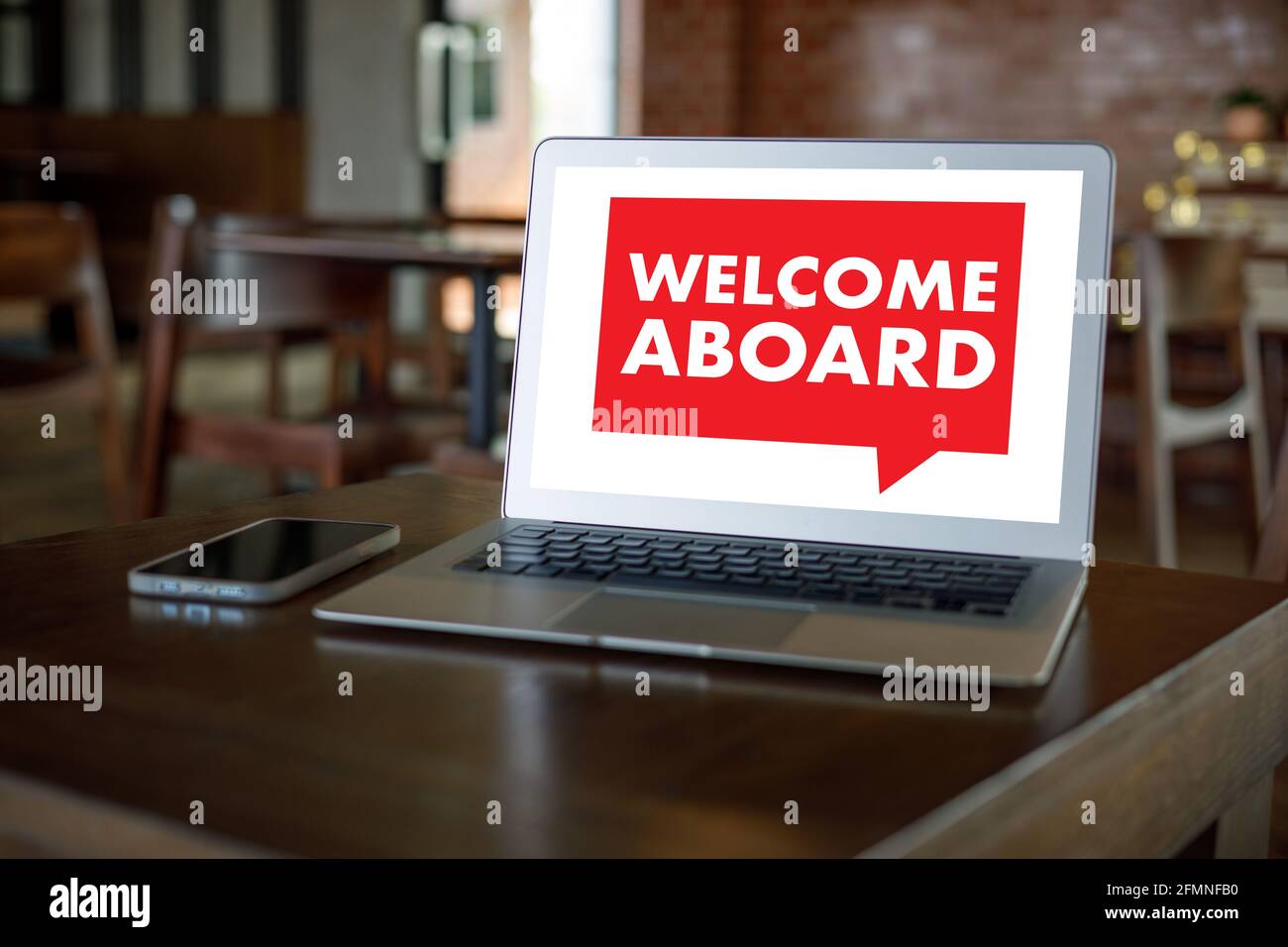 WELCOME ABOARD Business team hands at work with financial WELCOME ...