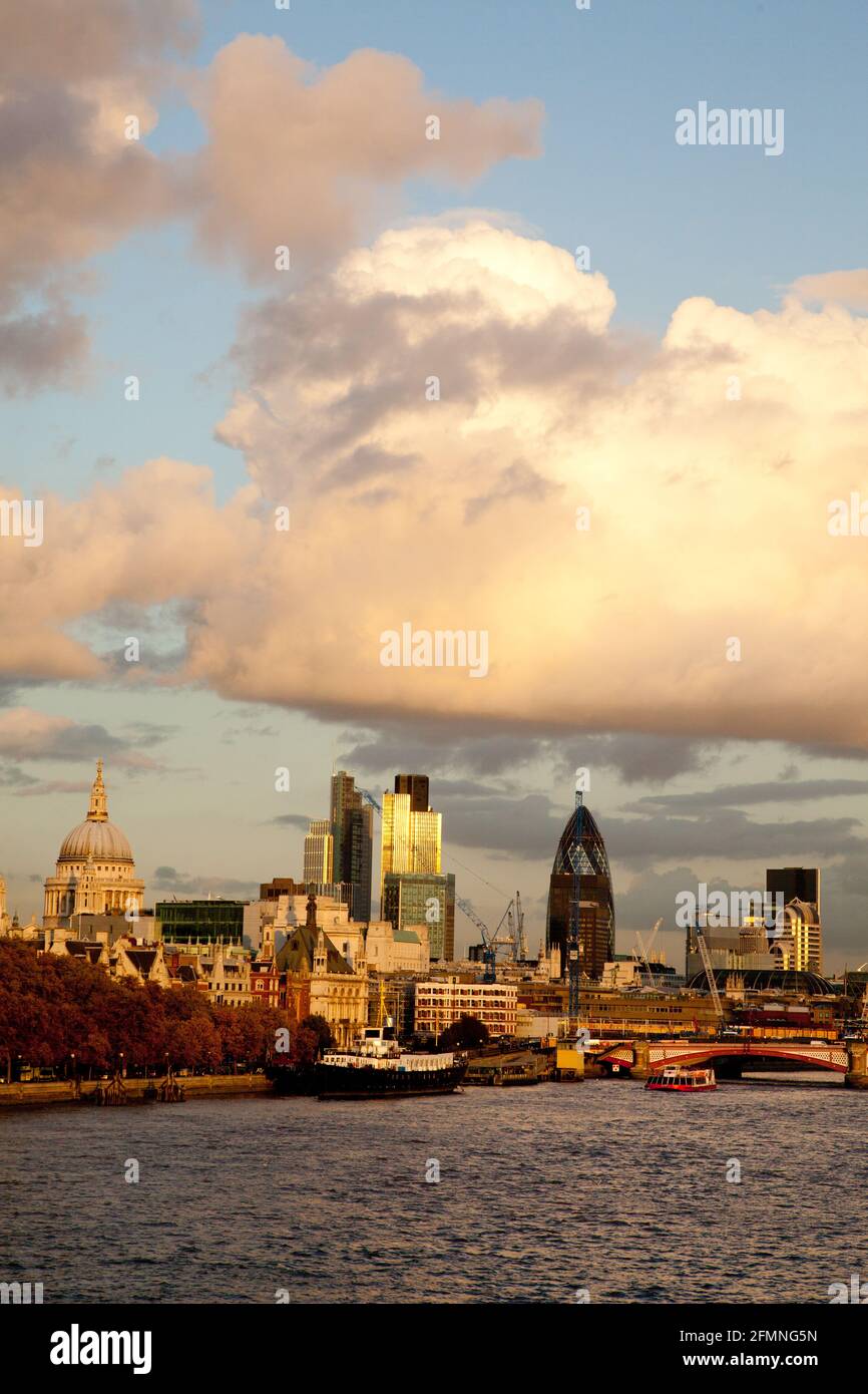 Vertical portrait of the London skyline with St Pauls in evening warm ...