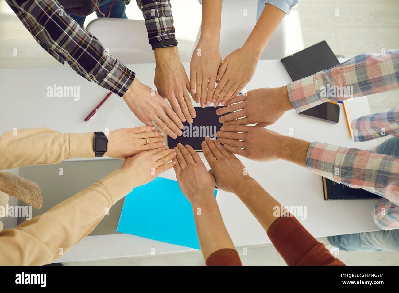 People's hands, which they fold together so that the circle is formed ...