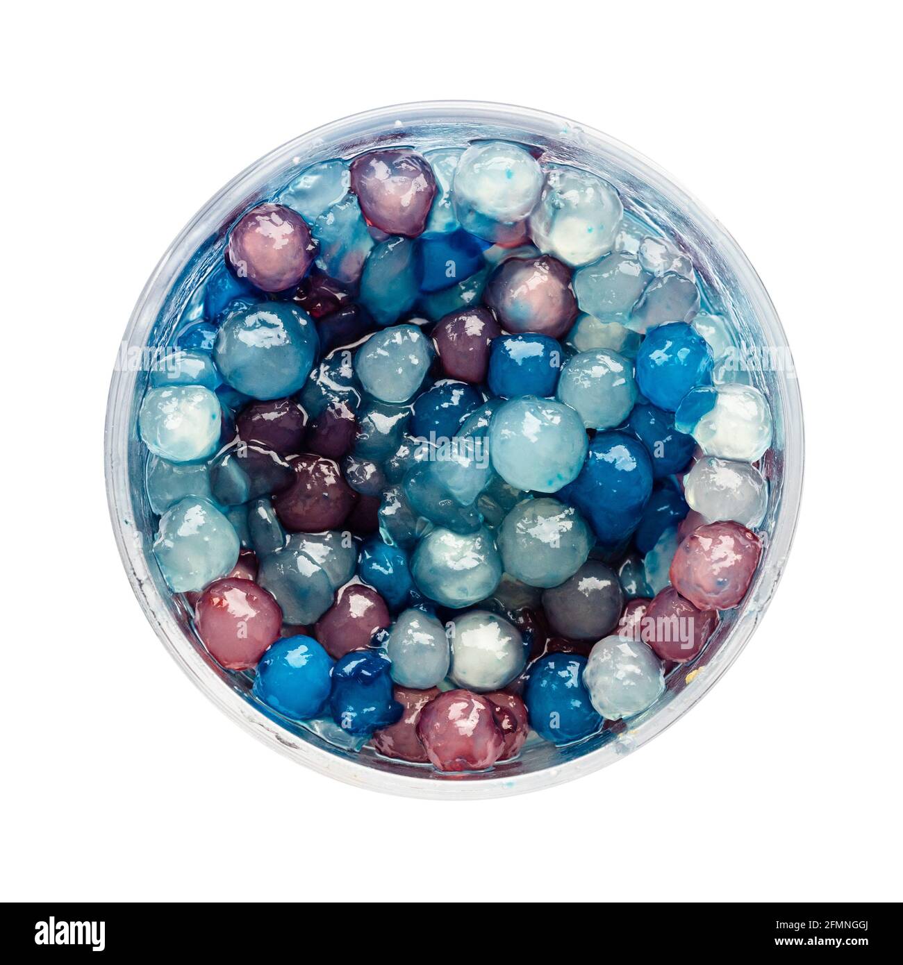 top view of colorful boiled tapioca balls in glass bowl cutout on white ...