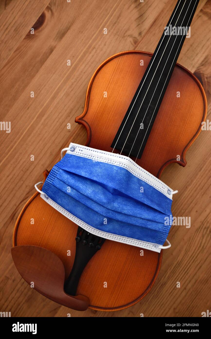 Protective surgical face mask wrapping an acoustic guitar symbol for ...