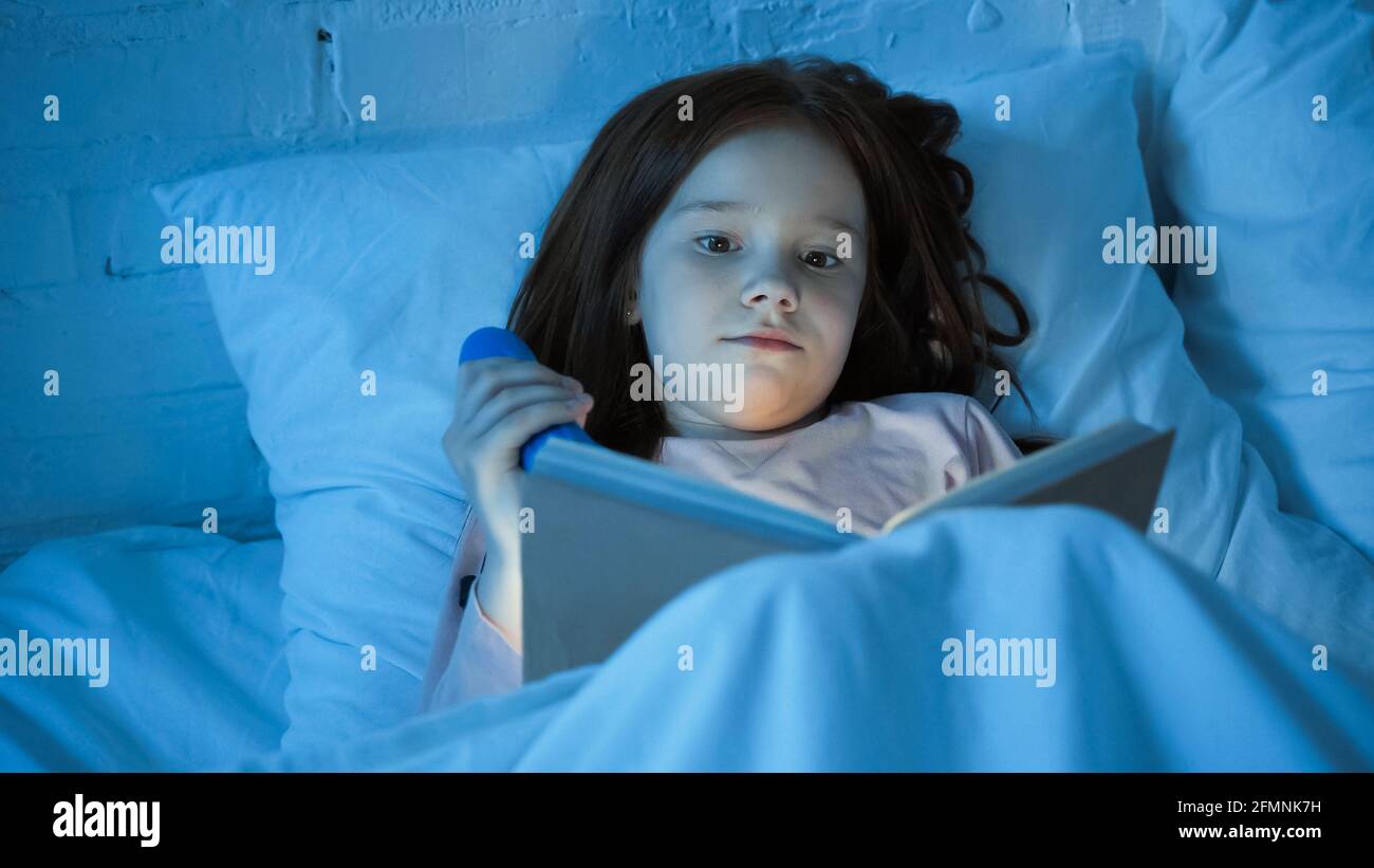 Child preteen flashlight bed hi-res stock photography and images - Alamy