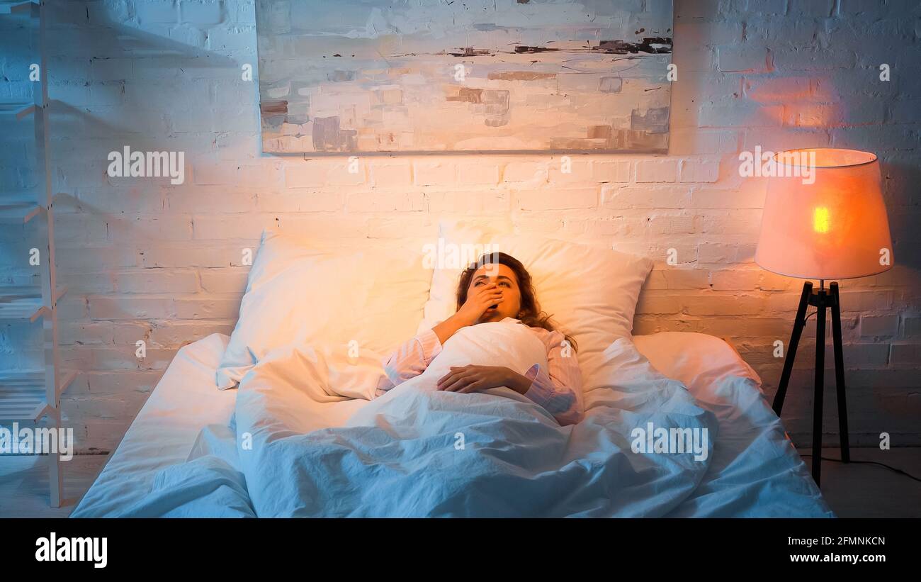 Yawning girl bed hi-res stock photography and images - Alamy