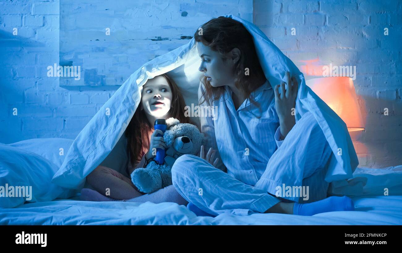 Child preteen flashlight bed hi-res stock photography and images - Alamy