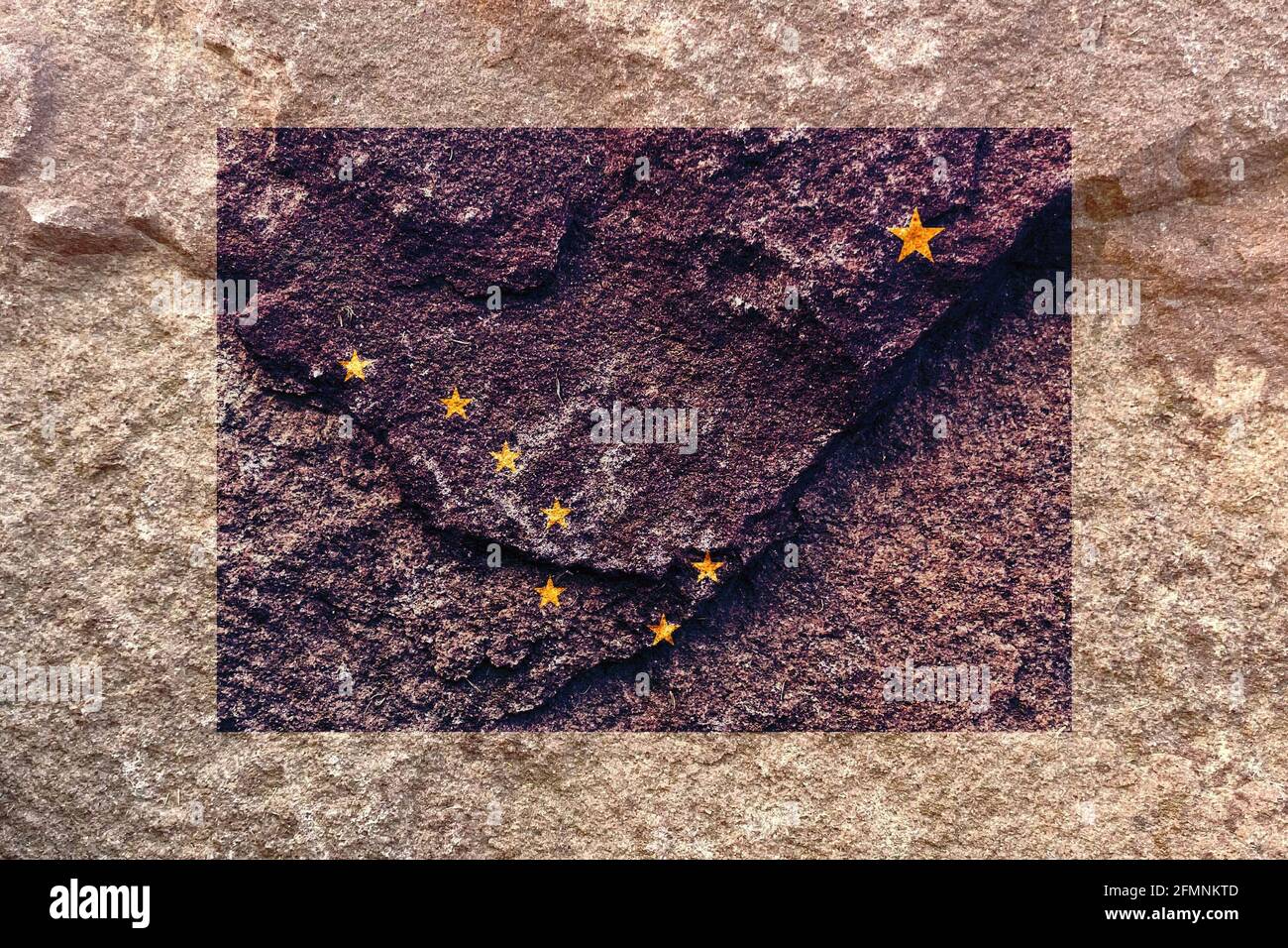 Faded Alaska state flag icon pattern isolated on weathered solid rock ...