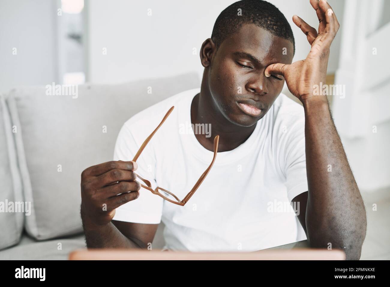 man of african appearance with glasses in hand freelance job Stock ...