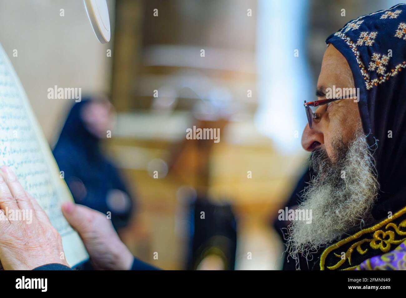 Jerusalem, Israel - April 30, 2021: Coptic priests and pilgrims pray ...
