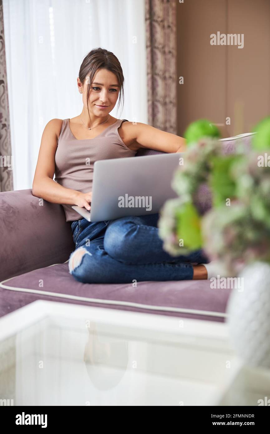 Pleased female person looking at screen of computer Stock Photo - Alamy