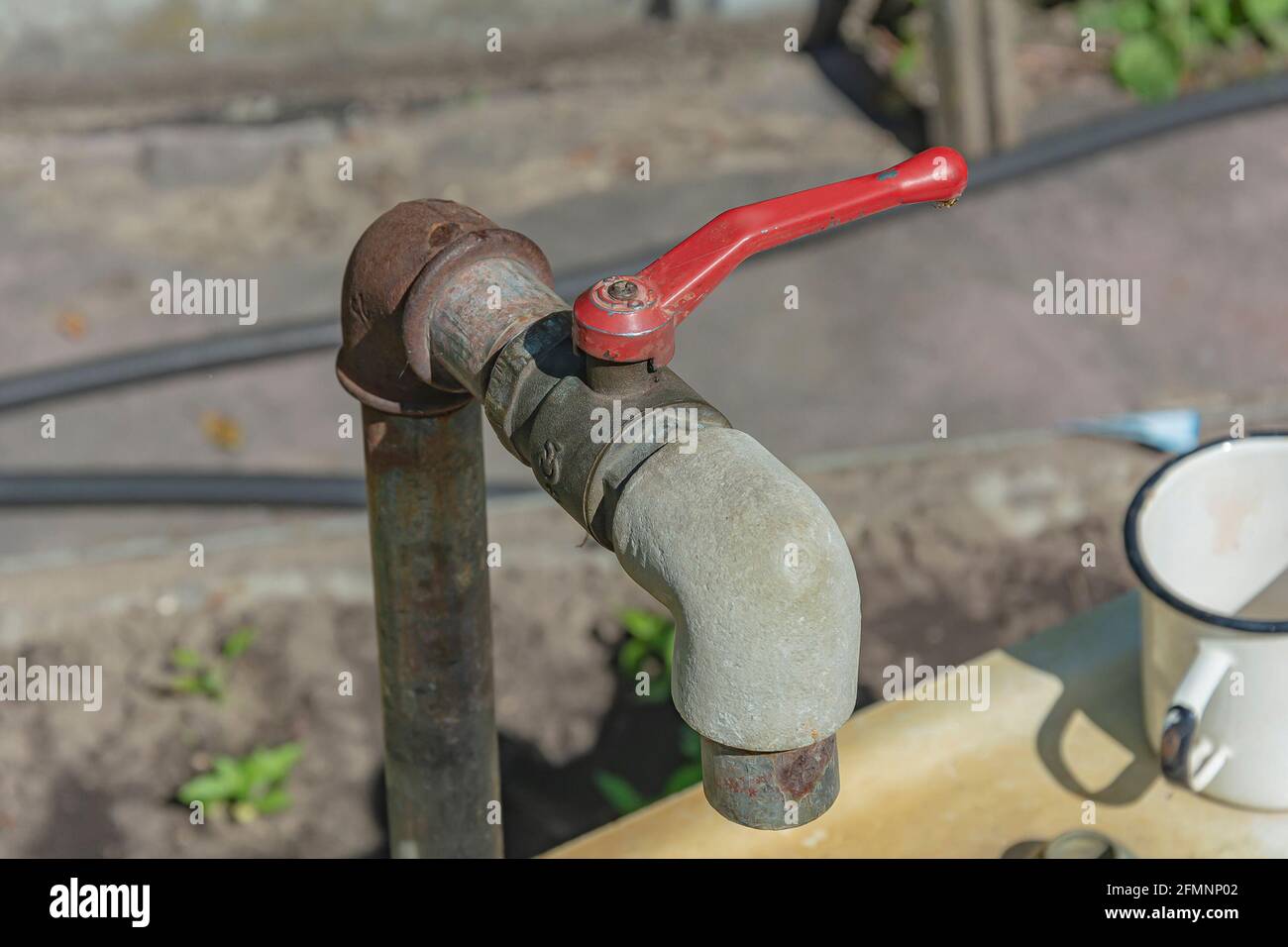 Ball water tap for watering plants on a private farmstead. Stock photo ...