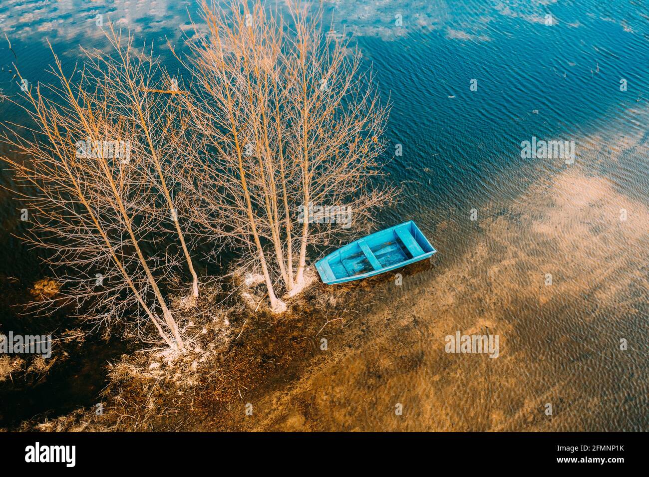 Spring river flood. Aerial Bird's-eye View Of Boat moored near trees ...