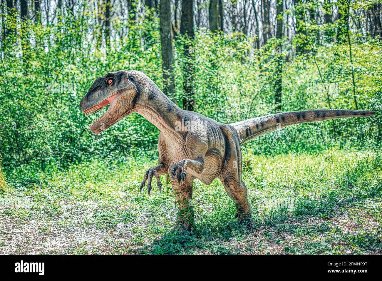 Dinosaur in the jungle Stock Photo - Alamy