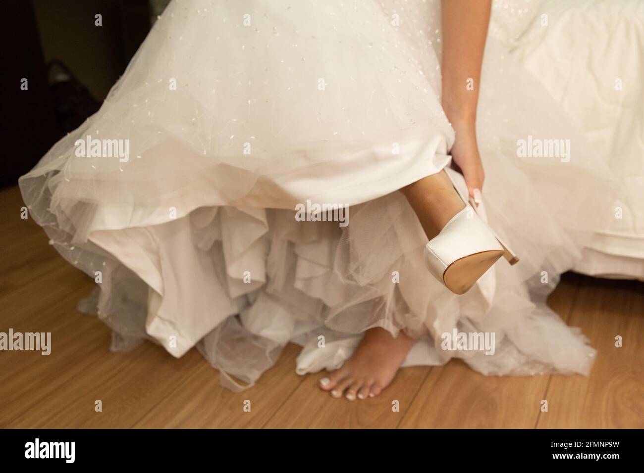 Bride shoes off hi-res stock photography and images - Alamy