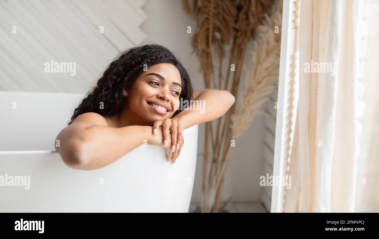 Happy African American Lady Taking Relaxing Bath In Modern Bathroom ...