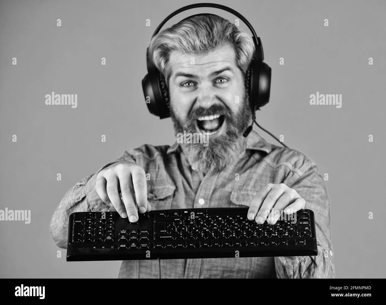 feeling of excitement. man headphones and keyboard. Professional Gamer ...